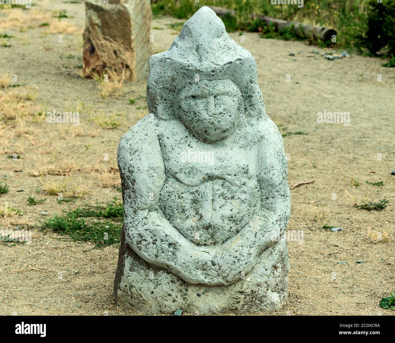 A stone anthropomorphic statue in a clearing Stock Photo - Alamy