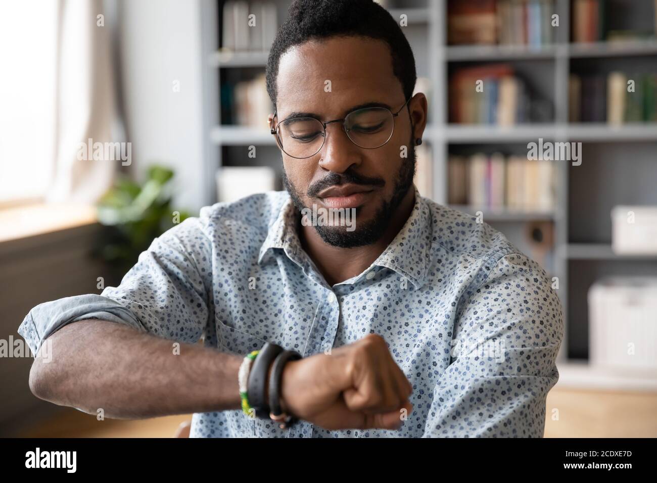 Looking at wrist hi-res stock photography and images - Alamy