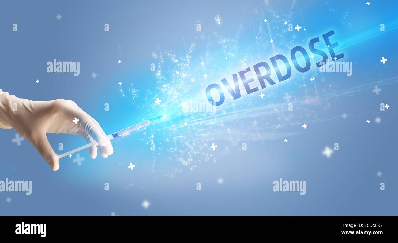 Syringe, medical injection in hand with OVERDOSE inscription, medical ...