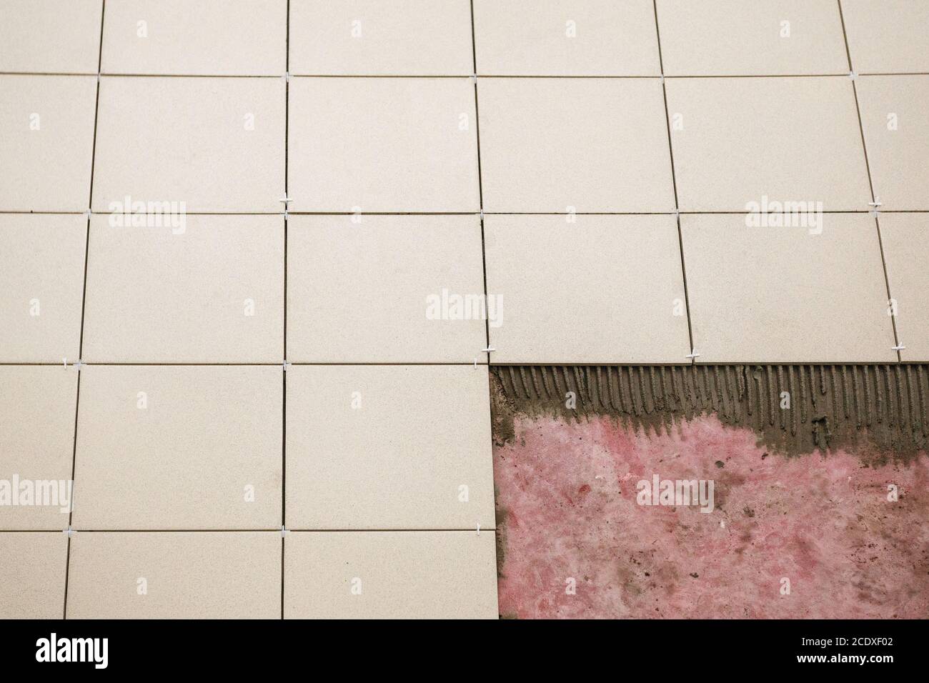 Installing ceramic floor tile hi-res stock photography and images - Alamy