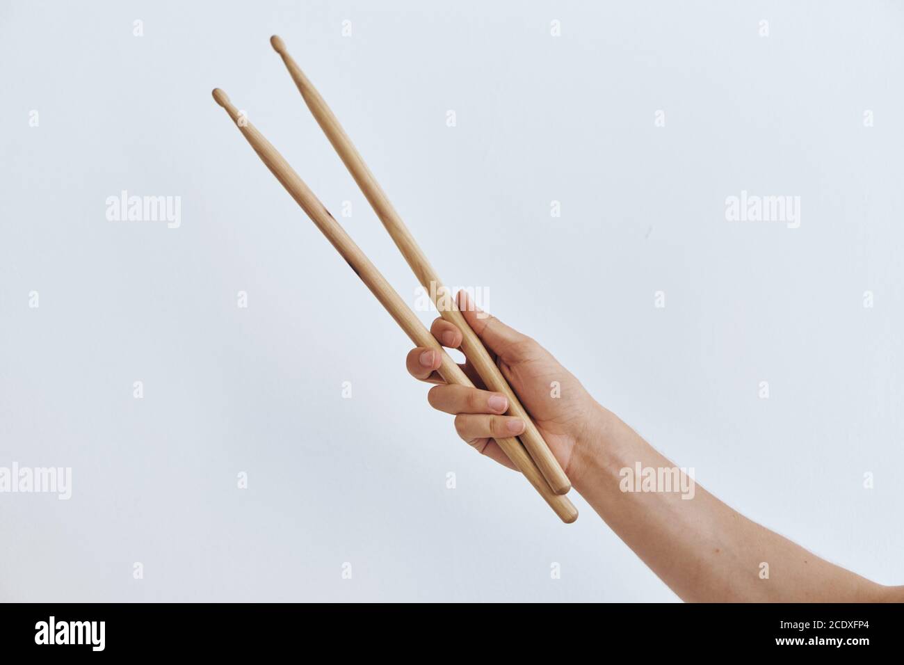 Drum sticks in hand musical instrument light background music ...