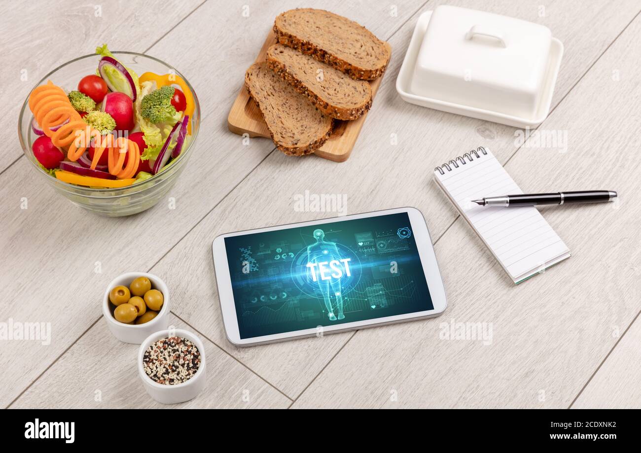 TEST concept in tablet with fruits, top view Stock Photo - Alamy