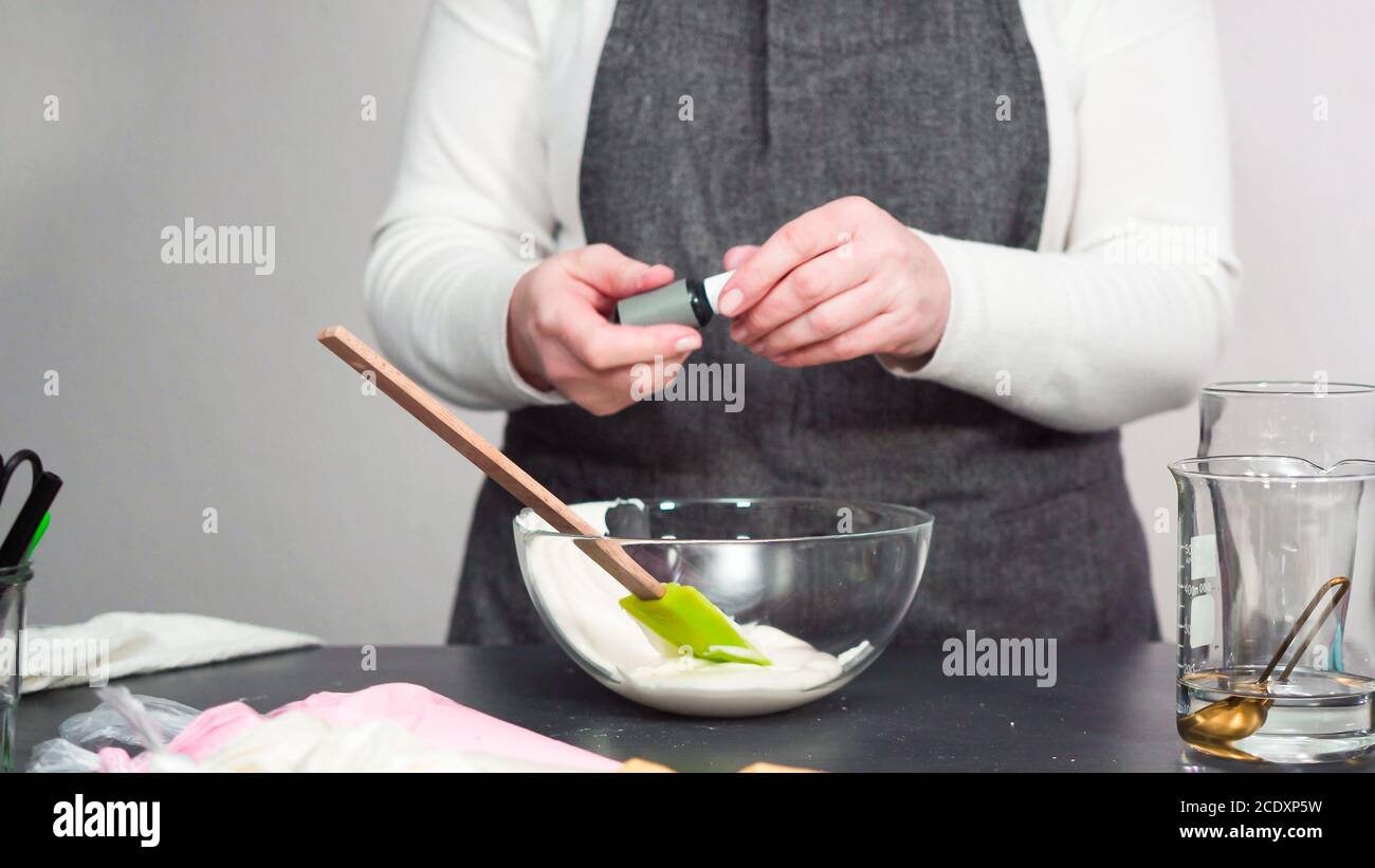 Step by step. Mixing in food coloring into the royal icing to decorate ...