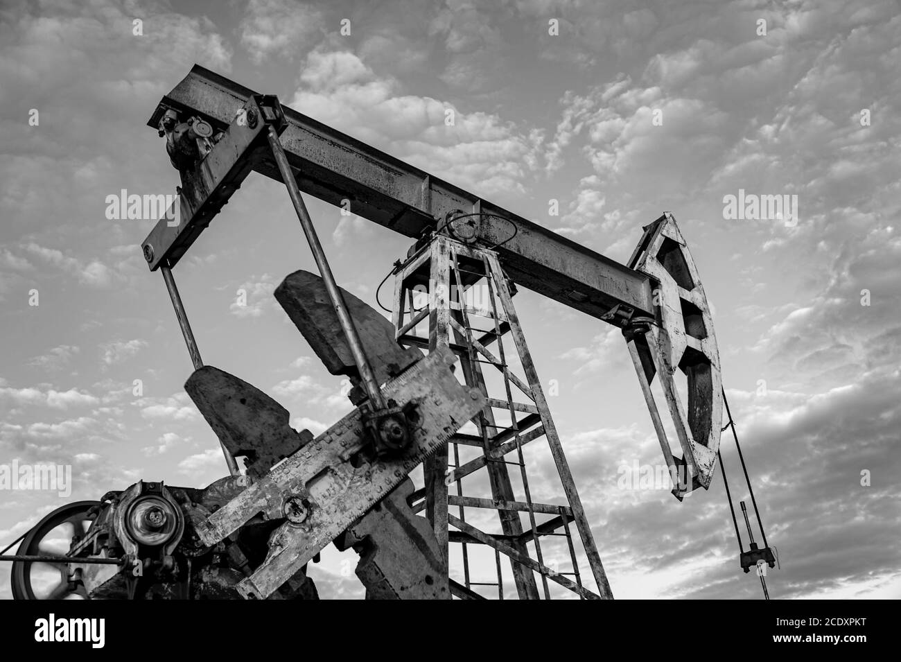 Oil pump rig. Oil and gas production. Oilfield site. Pump Jack are ...