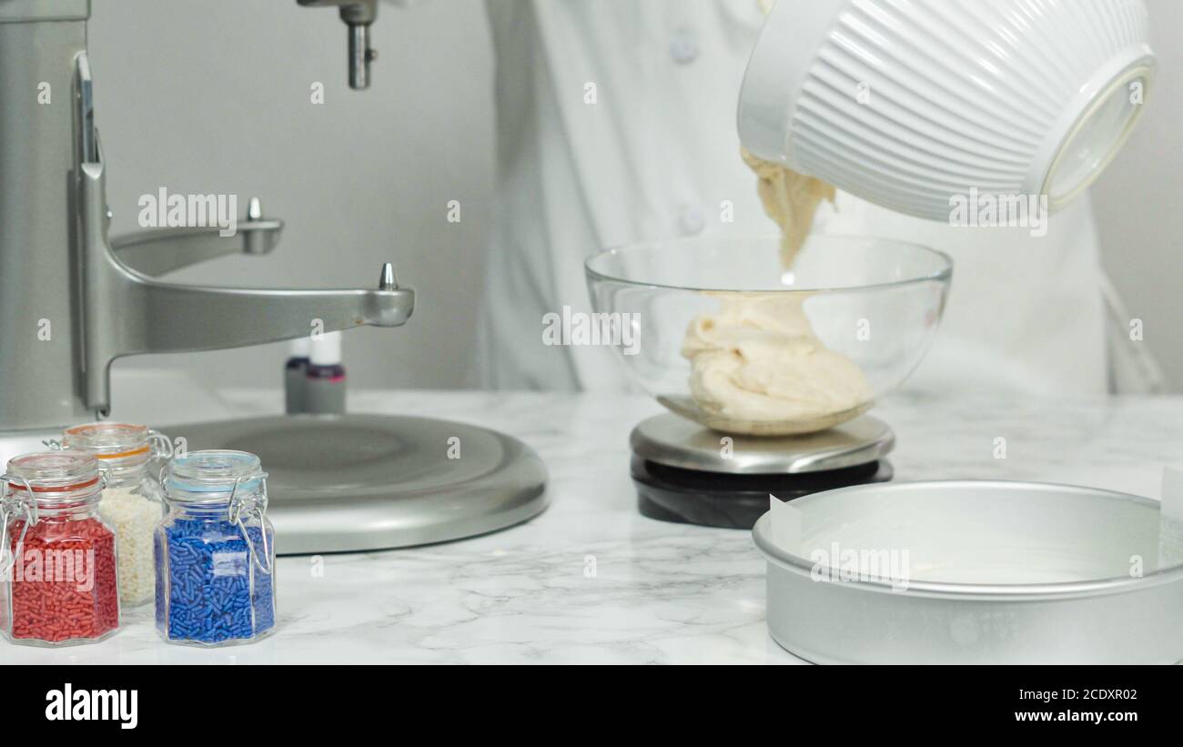 Step by step. Measuring cake batter with a digital kitchen scale to ...