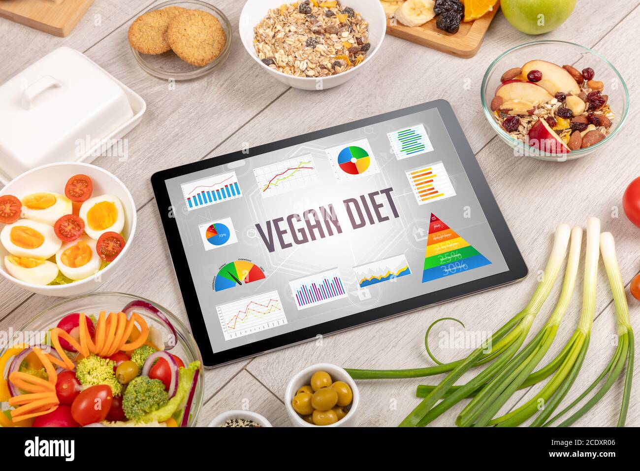 Organic food and tablet pc showing VEGAN DIET inscription, healthy ...