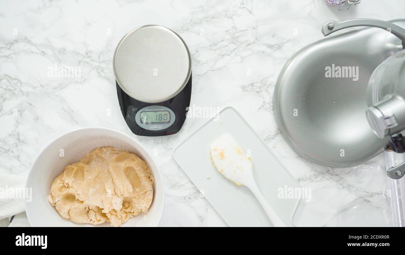Step by step. Flat lay. Measuring cookie dought with a digital kitchen ...