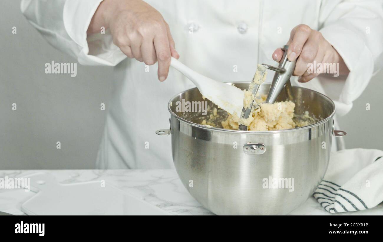Step by step. Mixing ingredients in standing kitchen mixer to bake ...