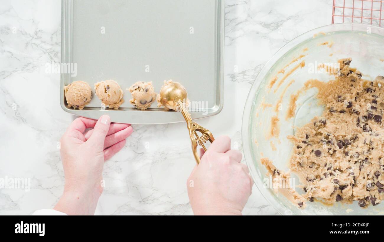 Step by step. Flat lay. Scooping homemade chocolate chip cookies with ...