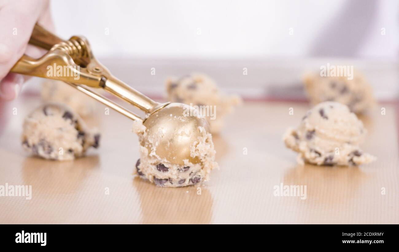 Step by step. Scooping homemade chocolate chip cookies with metal dough ...