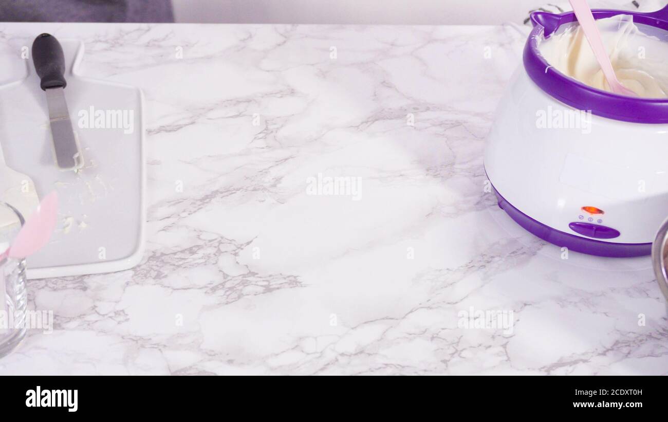 Step by step. Melting chocolate candy melts in an electric candy ...