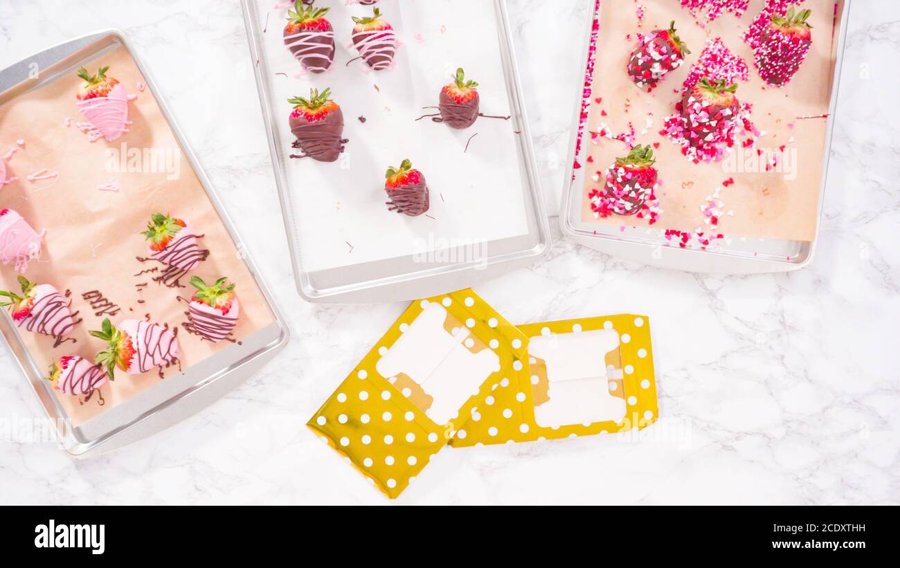 Flat lay. Step by step. Packing gourmet chocolate dipped strawberries ...