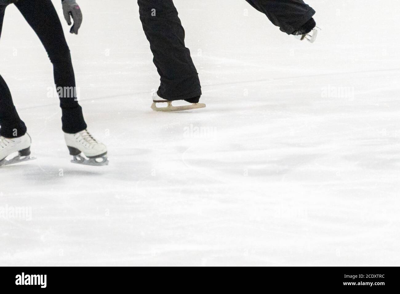 View of a figure skater and her coach feet at the figure skating ...
