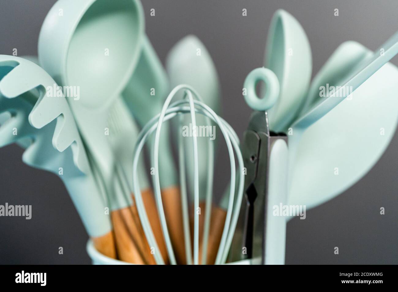 Variety of blue silicone kitchen utensils in a cup Stock Photo - Alamy
