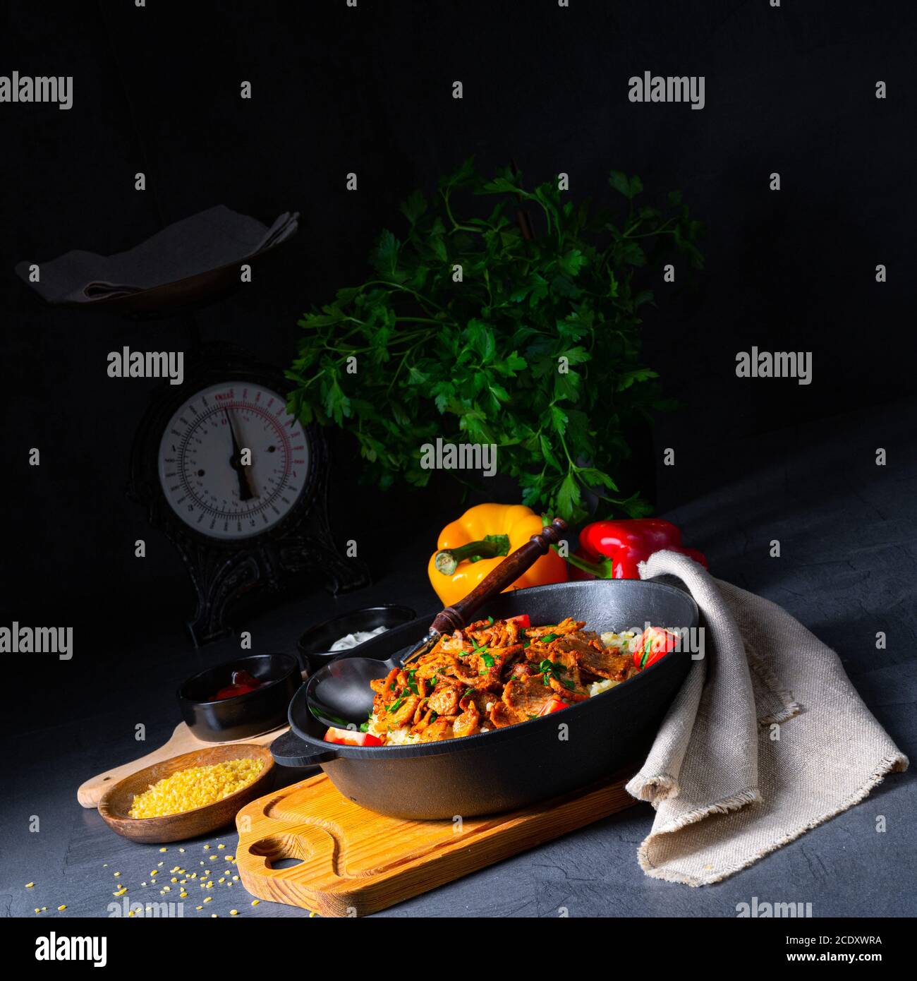 rustic bulgur pans with gratinated gyros and yoghurt Stock Photo - Alamy