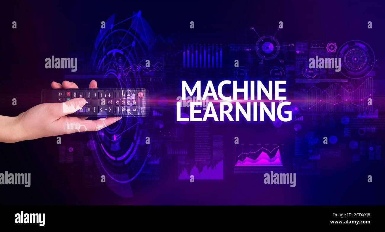 hand holding wireless peripheral with MACHINE LEARNING inscription ...