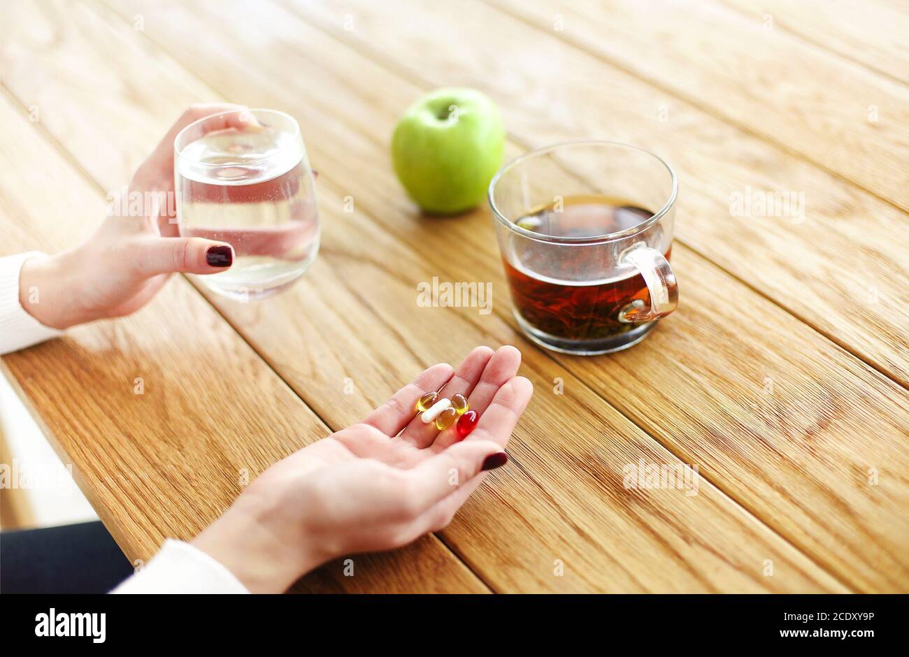 Taking capsule tablets hi-res stock photography and images - Alamy