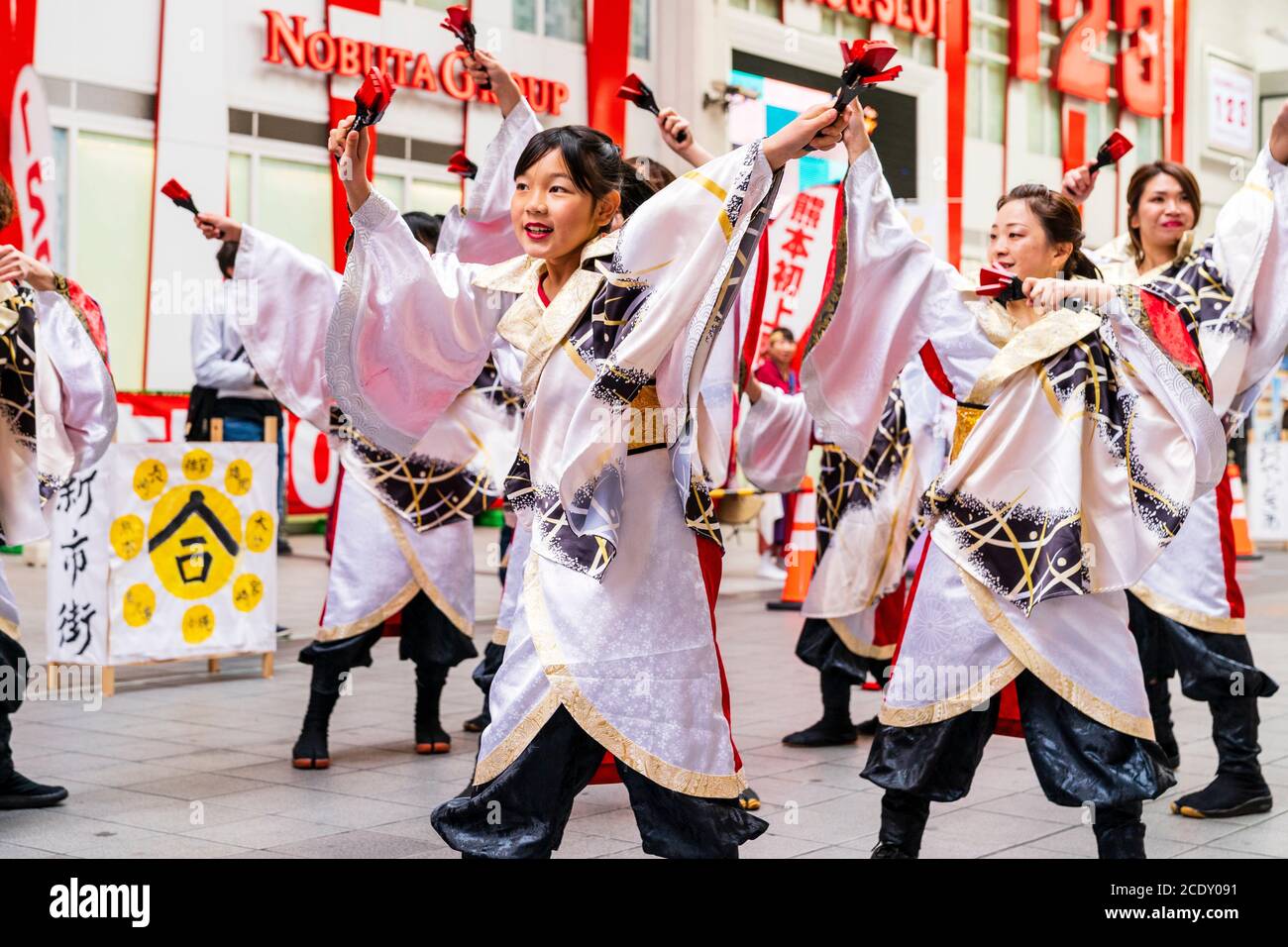 Japanese team of yosakoi dancers wearing long sleeved yukata dancing in ...