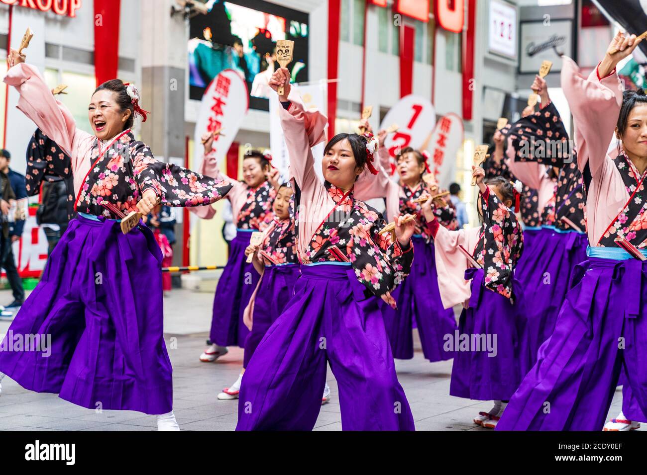 Japanese team of yosakoi dancers wearing long sleeved yukata and using ...