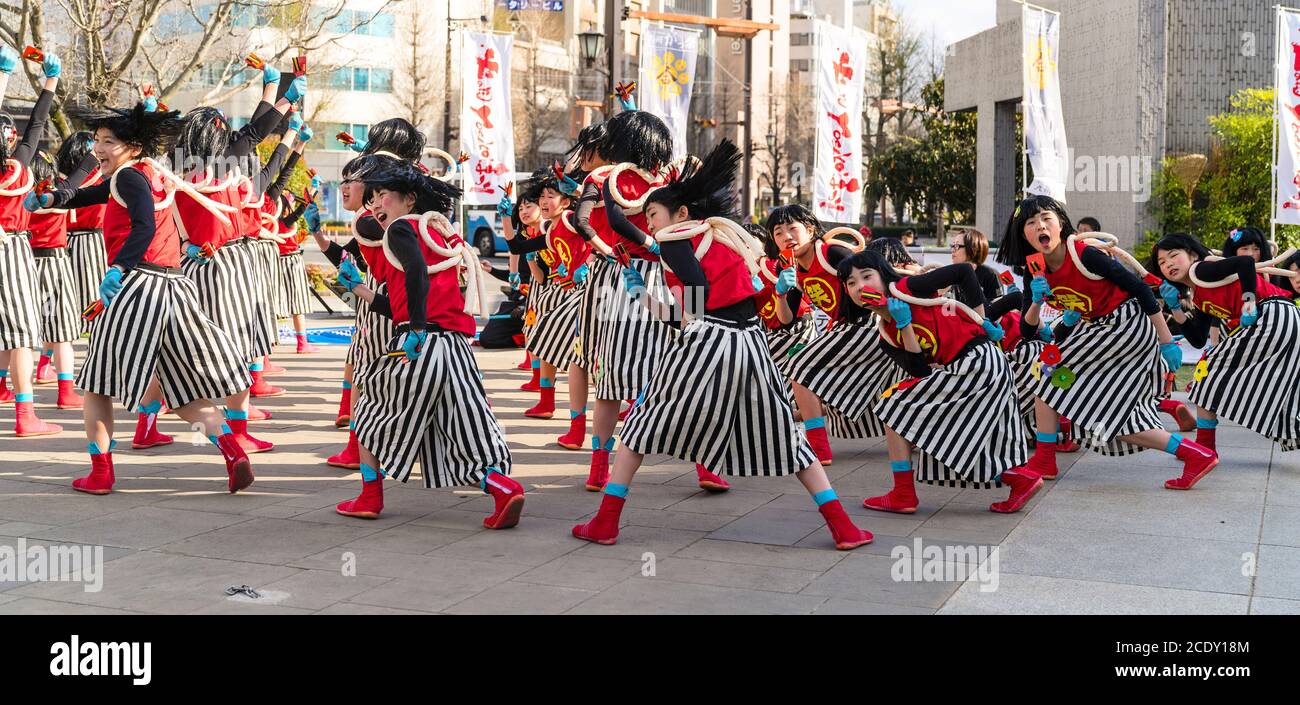 Team of Japanese child yosakoi dancers dancing while using naruko ...