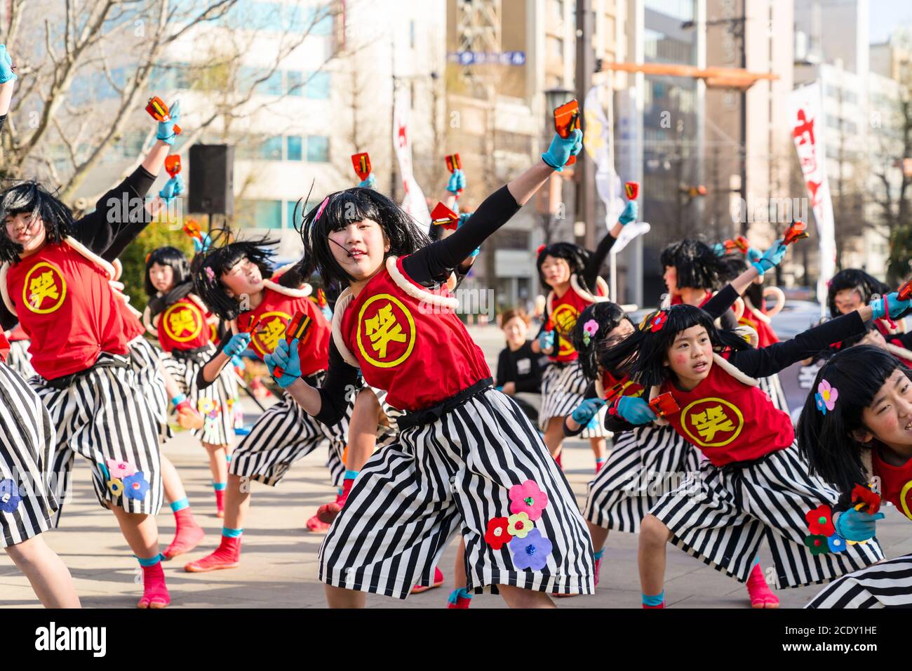 Team of Japanese child yosakoi dancers dancing while using naruko ...