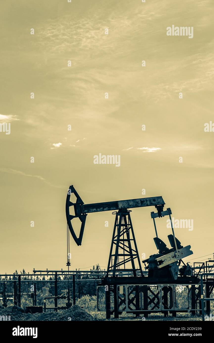 Petroleum concept. Oil pump rig. Oil and gas production. Oilfield site ...