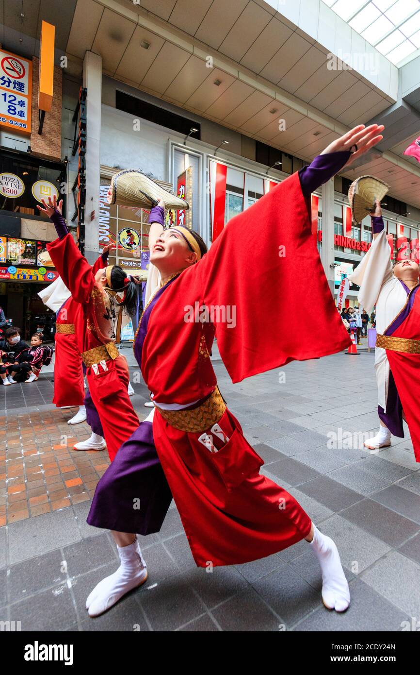 Japanese team of yosakoi dancers wearing long sleeved yukata and using ...