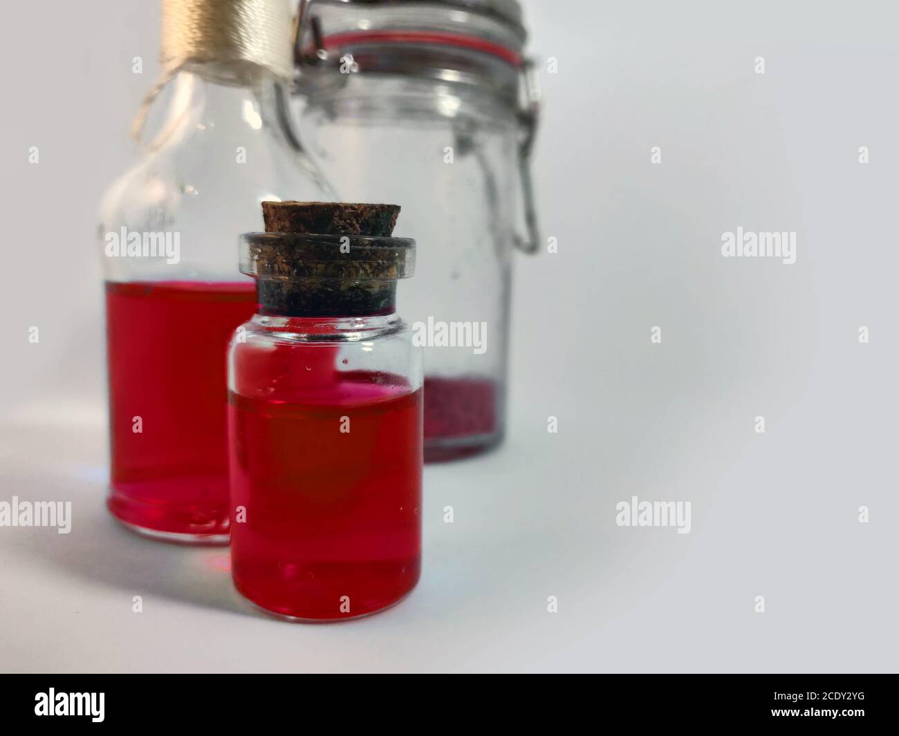Potions with red liquid. Alchemy set with flasks. small glass bottles ...