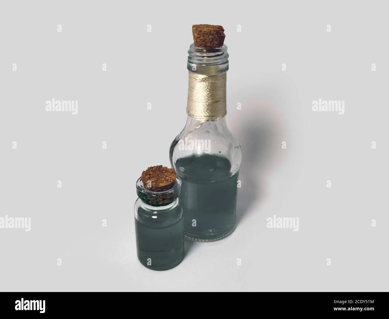 Potions with gray liquid. Alchemy set with flasks. small glass bottles ...