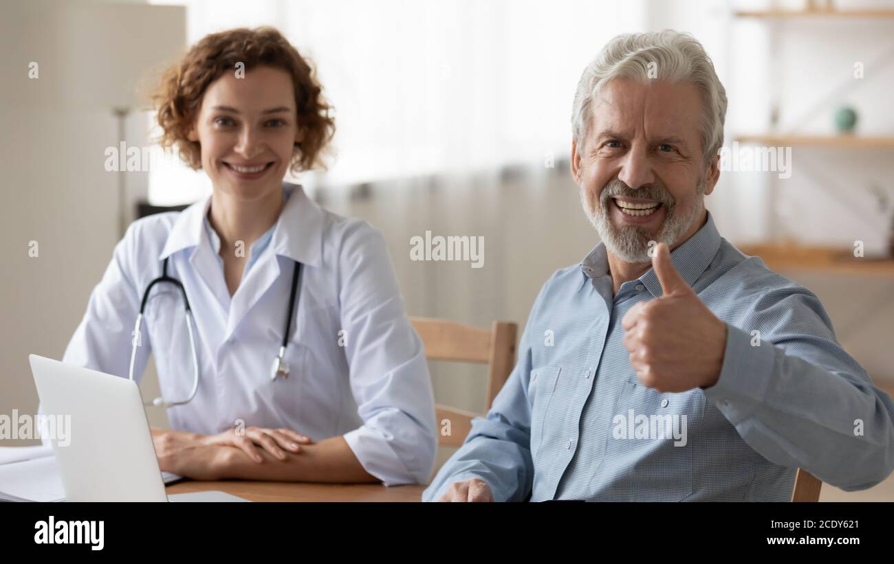 Head shot portrait smiling mature patient showing thumb up Stock Photo ...
