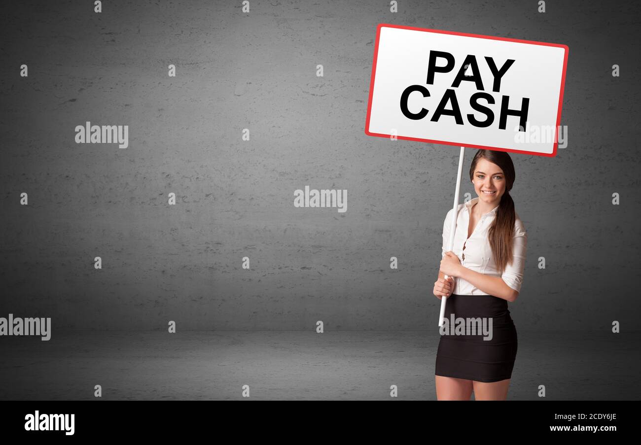 business person holding a traffic sign with PAY CASH inscription, new ...