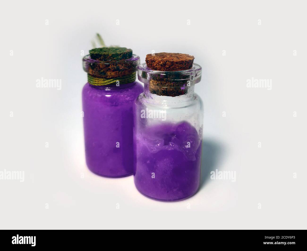 Potions with violet liquid. Alchemy set with flasks. small glass ...
