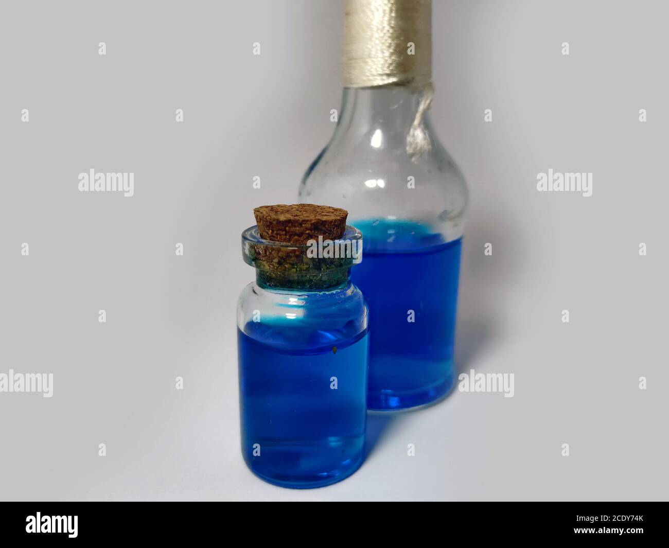 Potions with blue liquid mana. Alchemy set with flasks. small glass ...