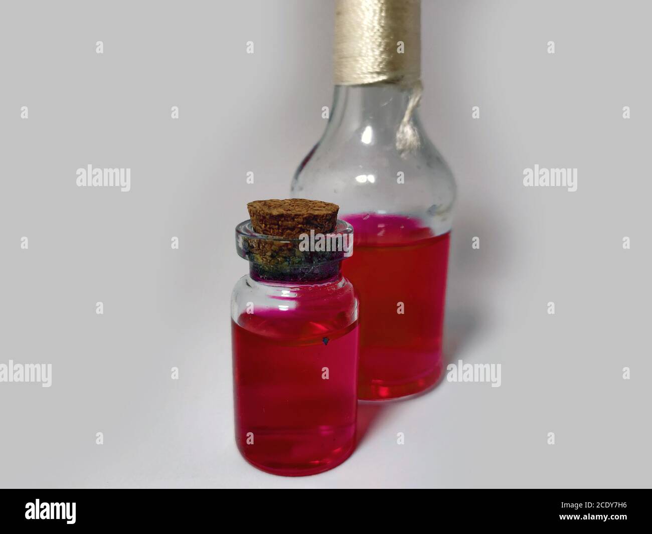 Potions with red liquid. Alchemy set with flasks. small glass bottles ...