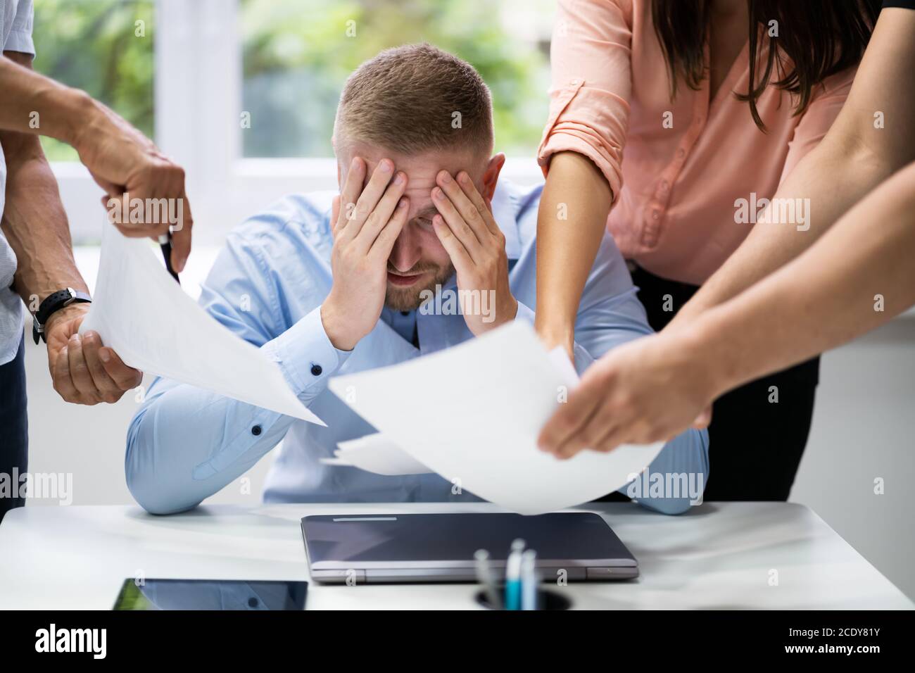 Stress At Workplace In Office. Business Headache Stock Photo - Alamy