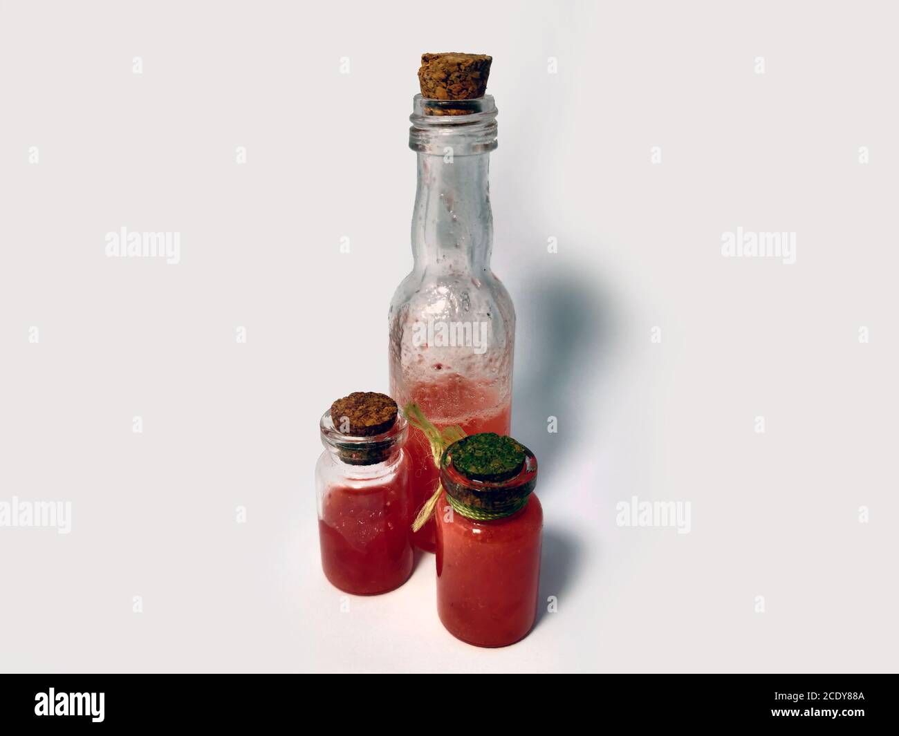 Potions with red liquid. Alchemy set with flasks. small glass bottles ...