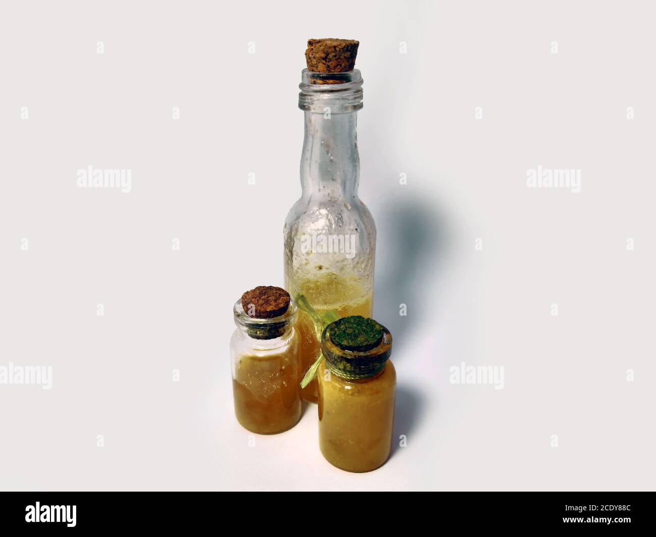Potions with yellow liquid. Alchemy set with flasks. small glass ...