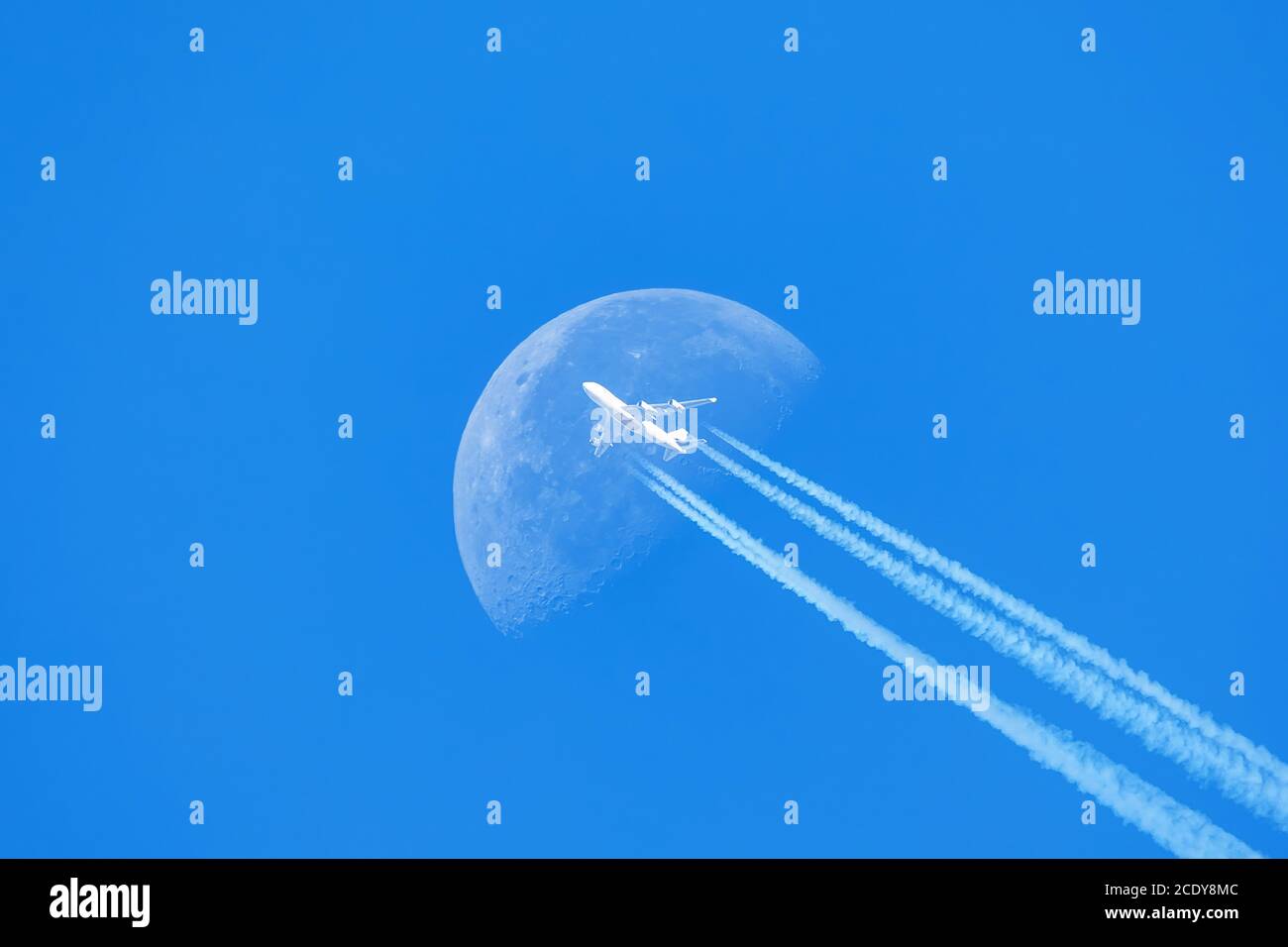 Passenger plane passes near the sun Stock Photo - Alamy