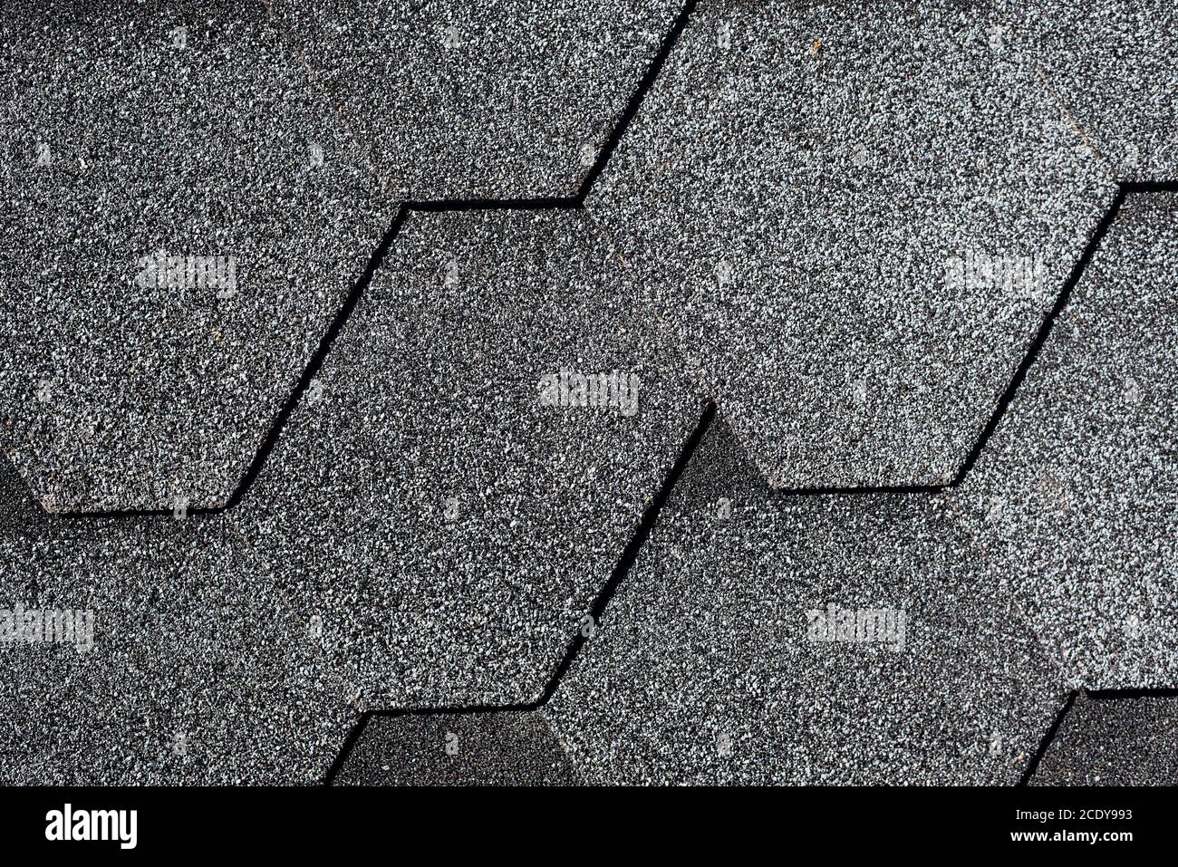 Closeup of gray asphalt roof shingles texture. Roof covered by ...