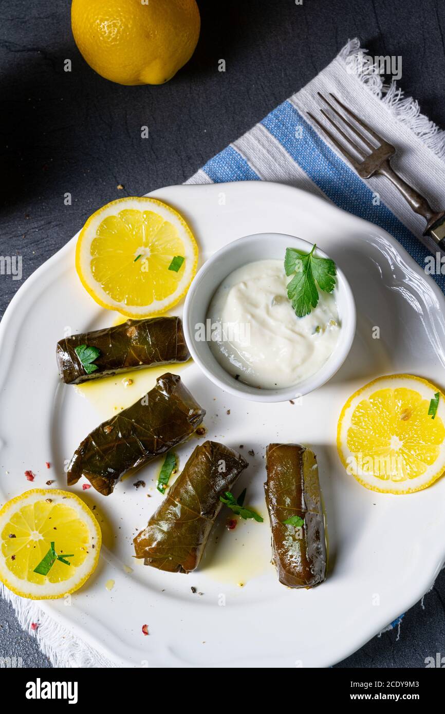 Dolmades - stuffed grape leaves the Greek way Stock Photo - Alamy