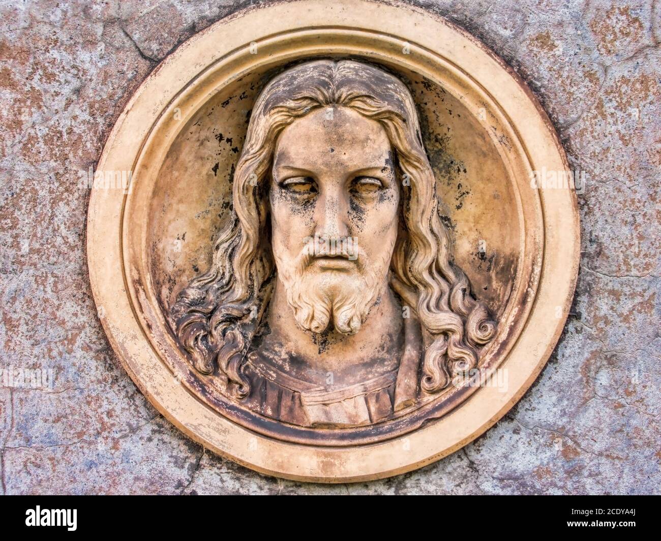 Weathered relief with Jesus Christ in Berlin, Germany Stock Photo - Alamy