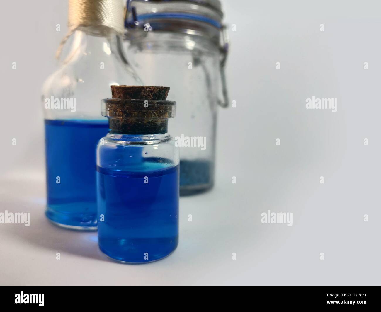 Potions with blue liquid mana. Alchemy set with flasks. small glass ...