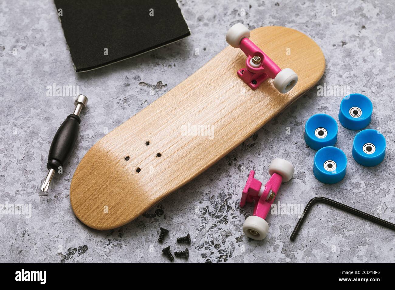 Disassembled fingerboard and various accessories on the table with ...