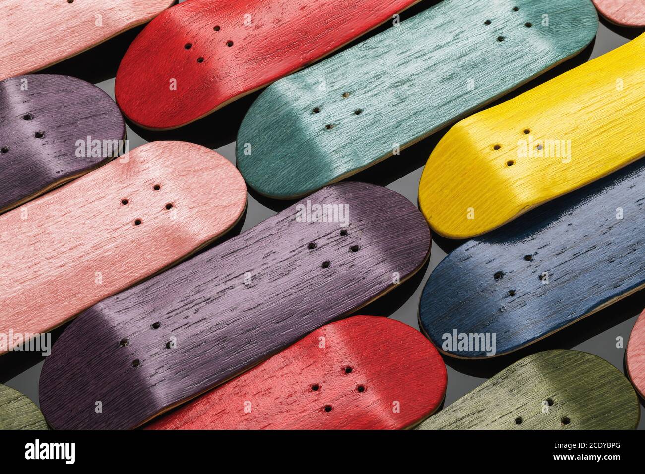 Background from multi-colored boards for fingerboards Stock Photo - Alamy