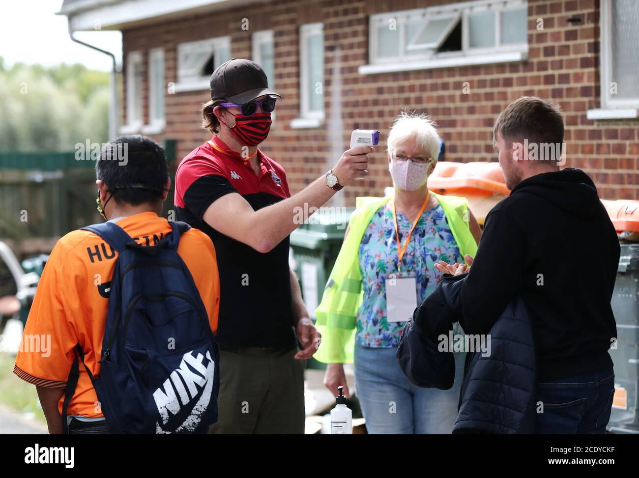 Fans have their temperature measured during the pre-season friendly ...