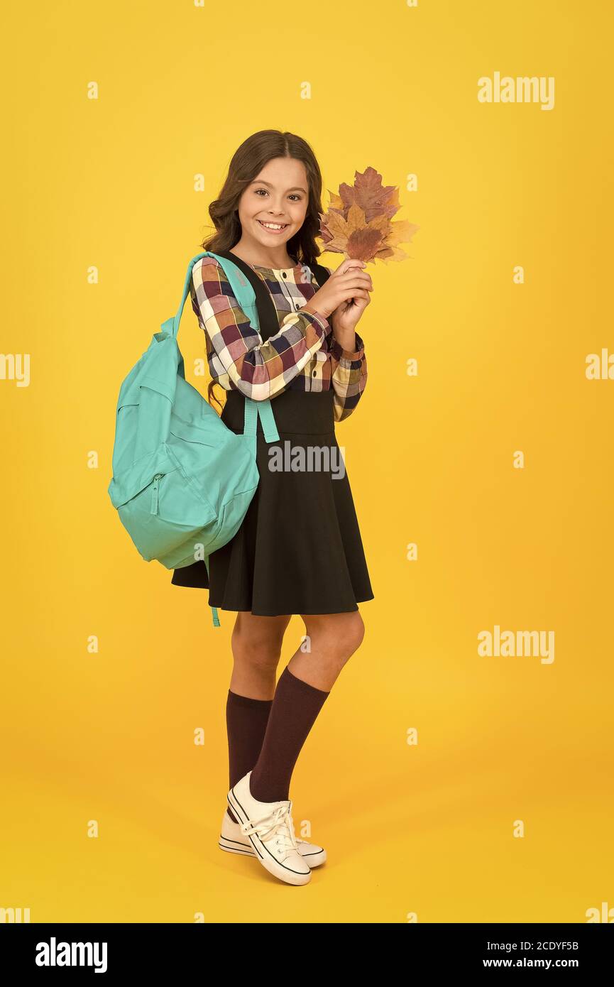 Shaping little minds in school. Happy little girl enjoy autumn. Little ...