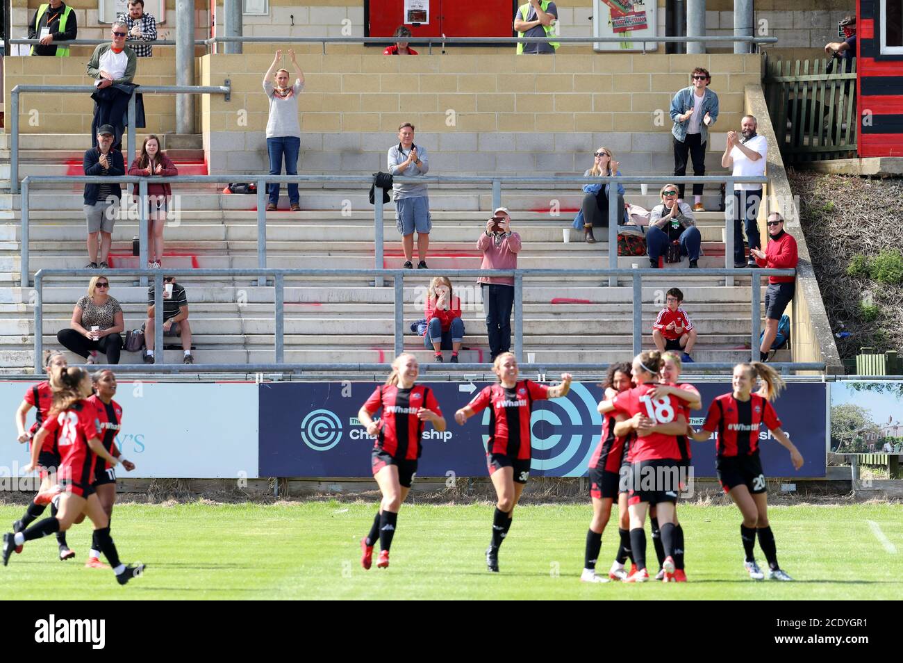 Socially distanced fans in the stands celebrate as Lewes celebrate a ...
