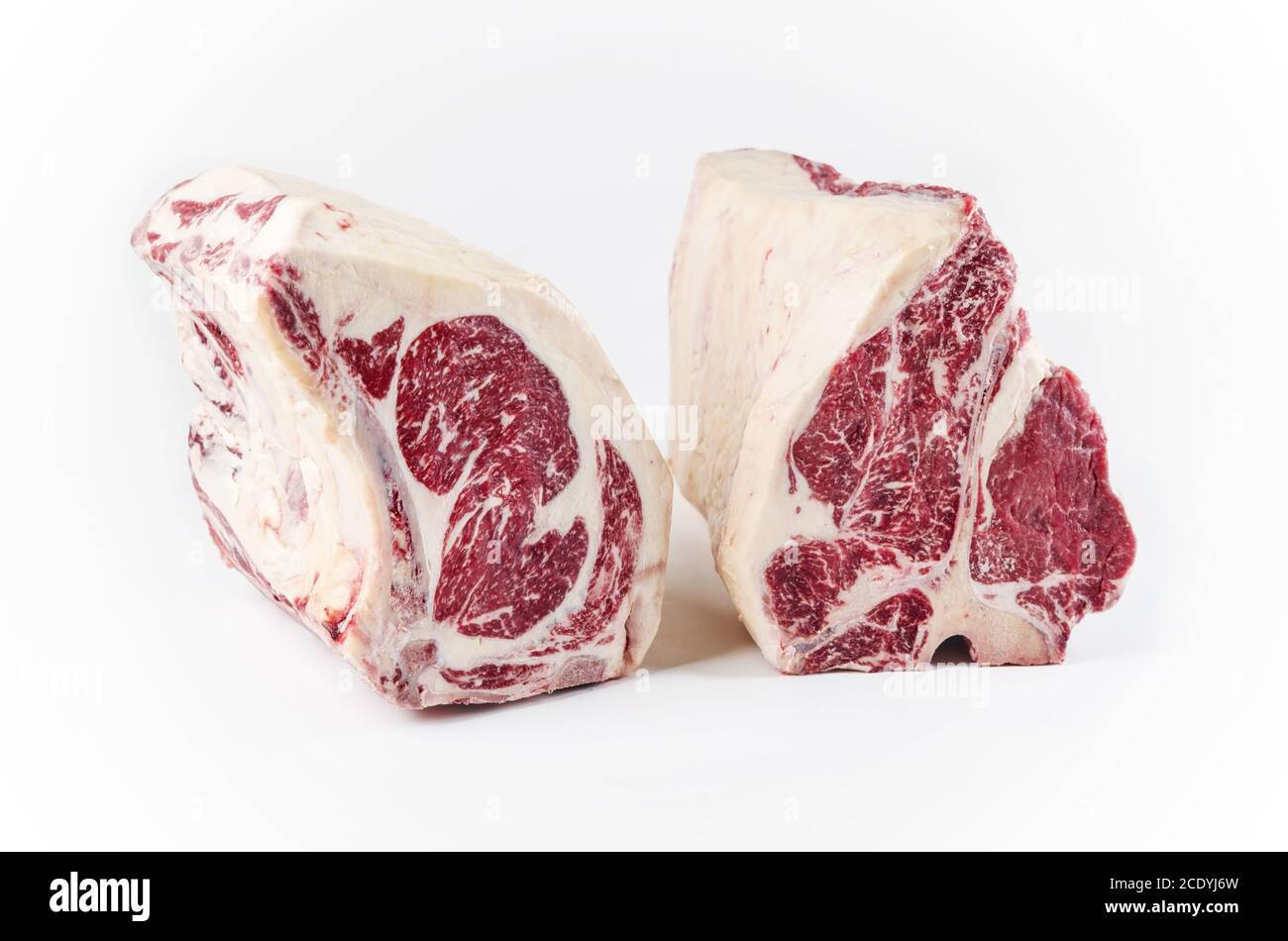 Raw dry aged wagyu porterhouse and cote de boeuf beef block as closeup ...