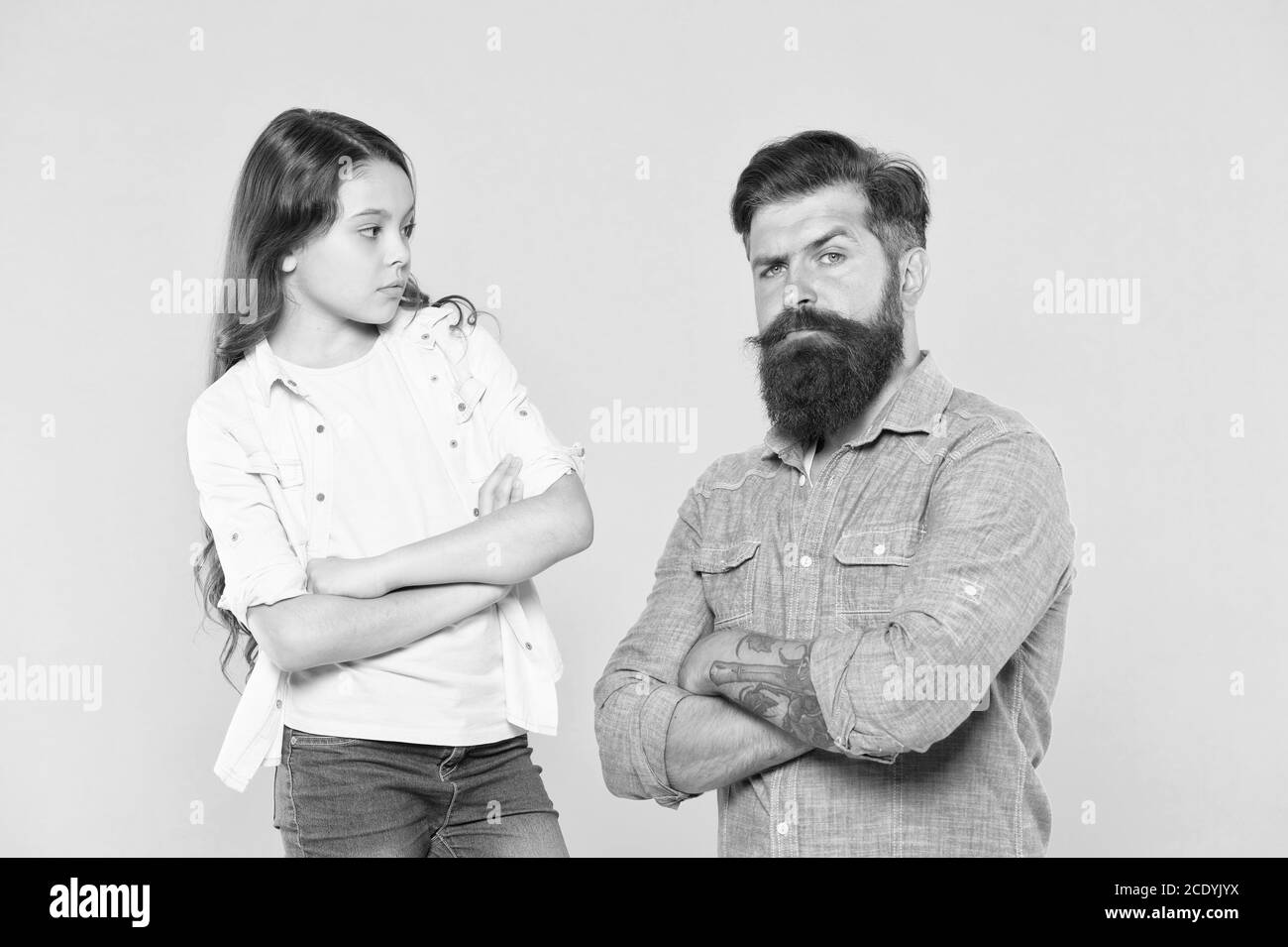 Focus on future. Little child look at father yellow background. Small ...