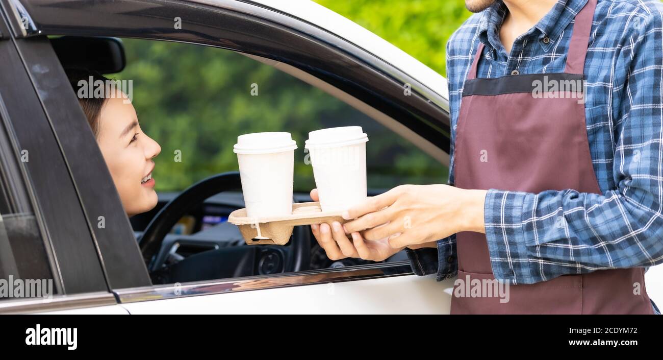 Panoramic Waiter deliver food throght drive thru service Stock Photo ...